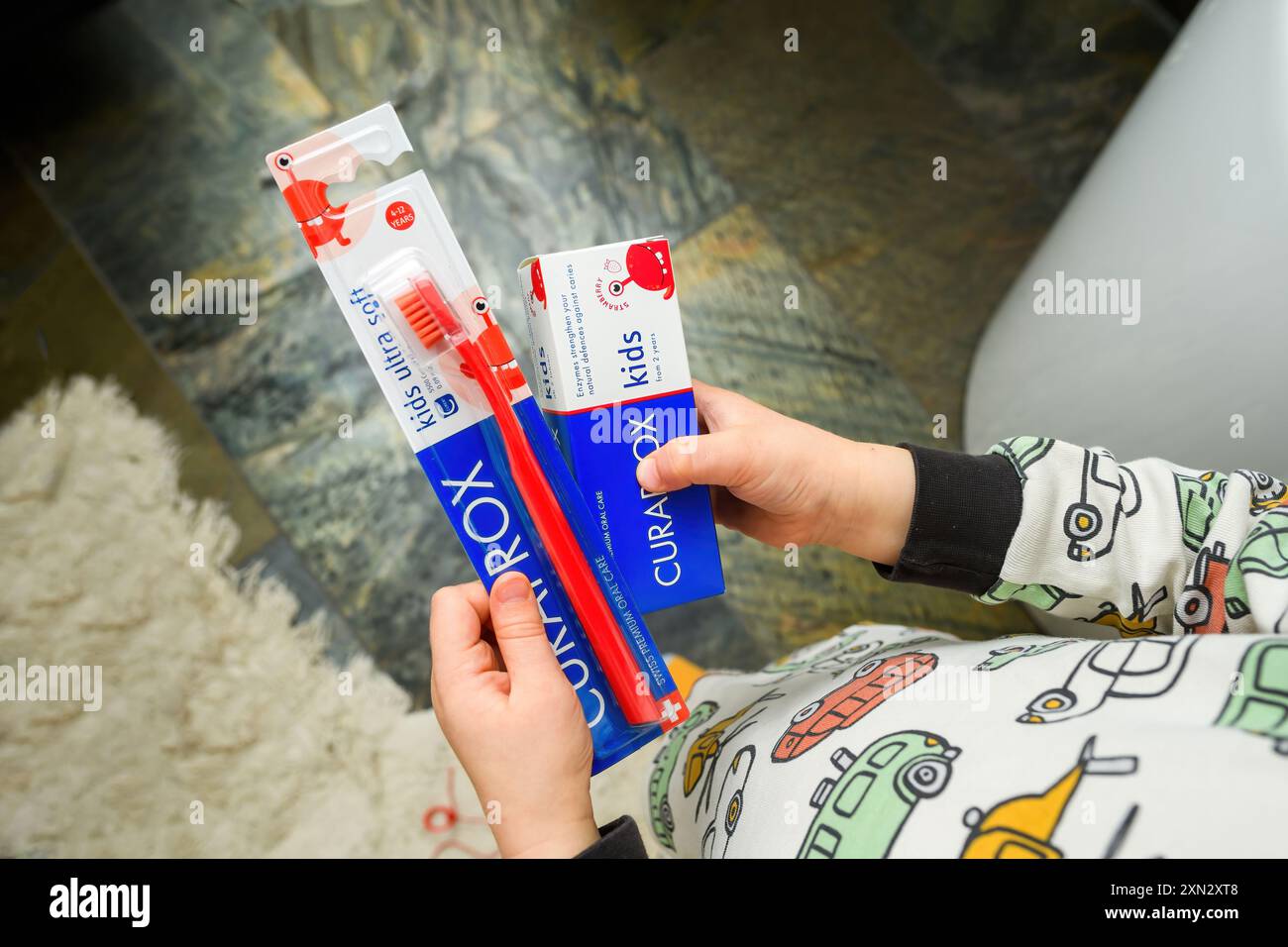 Paris, France - Mar 21, 2024: Overhead view of a toddler happily ...