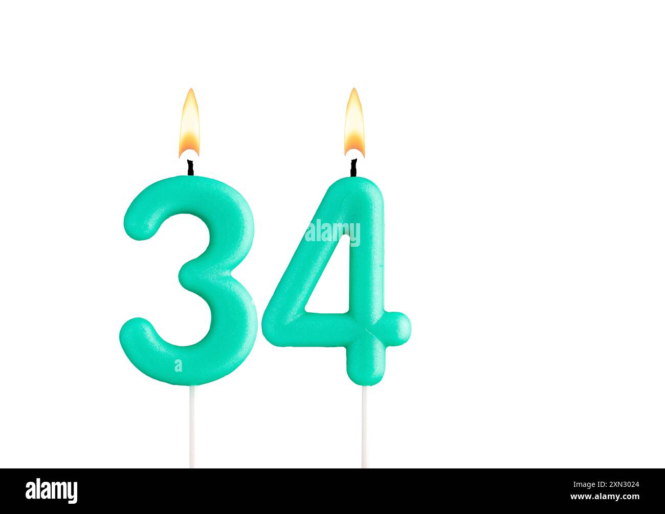 Birthday number 34 - Green birthday candle on white background Stock ...