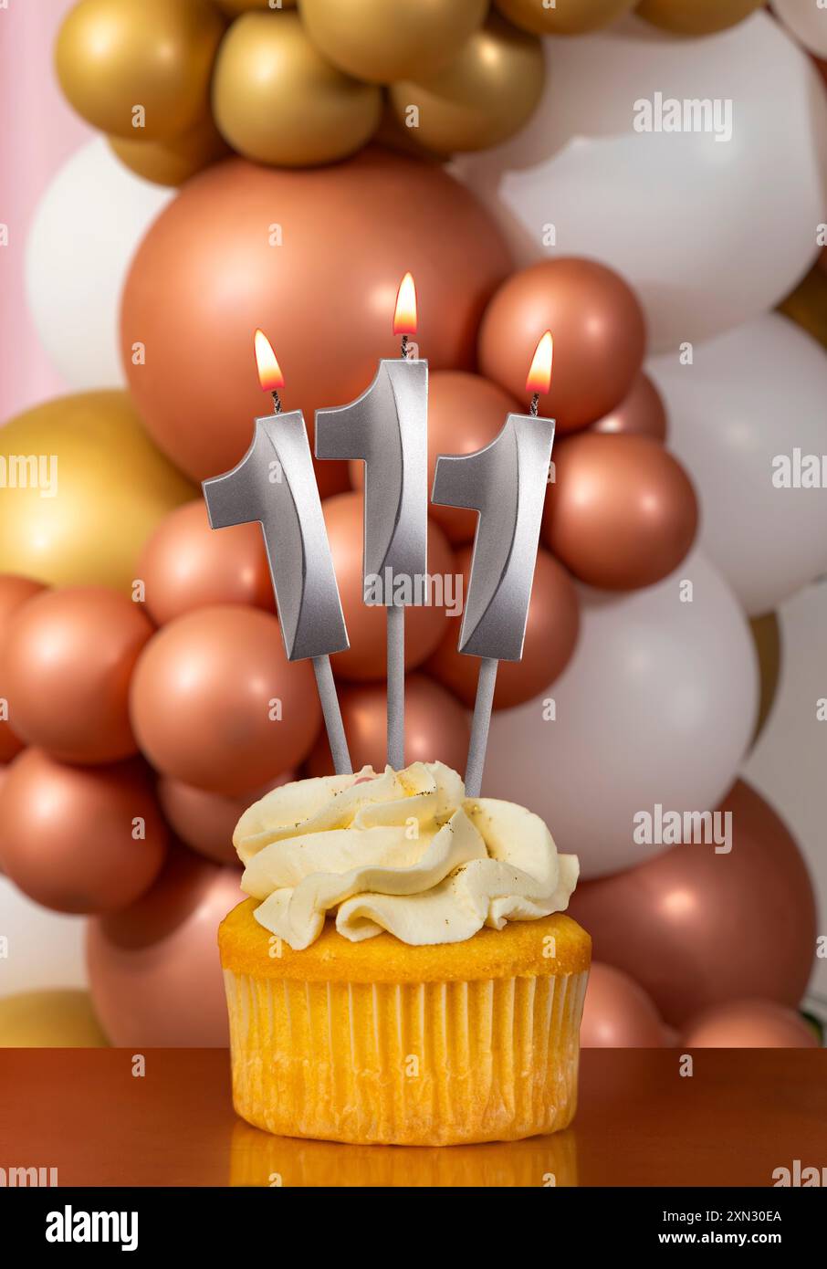 Cupcake with birthday candle on balloons background - Number 111 Stock ...