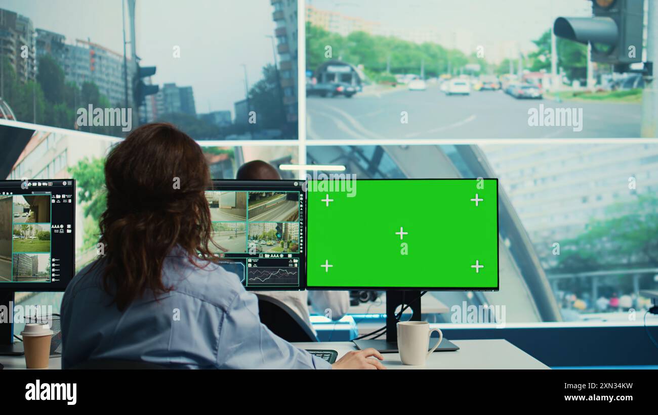 Agency employee works with greenscreen display and monitoring traffic ...