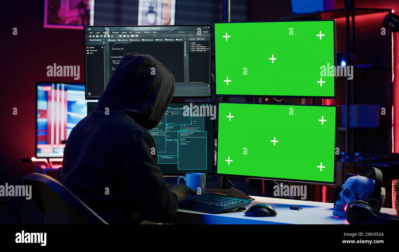 Hacker Developing Spyware Software On Green Screen Computer To Steal