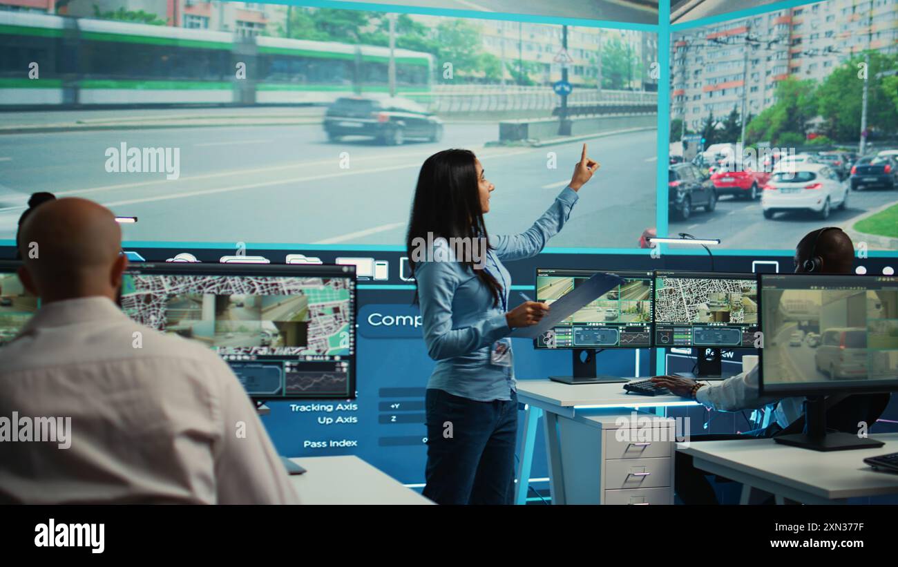 Indian supervisor assigning tasks for her operators team in observation ...