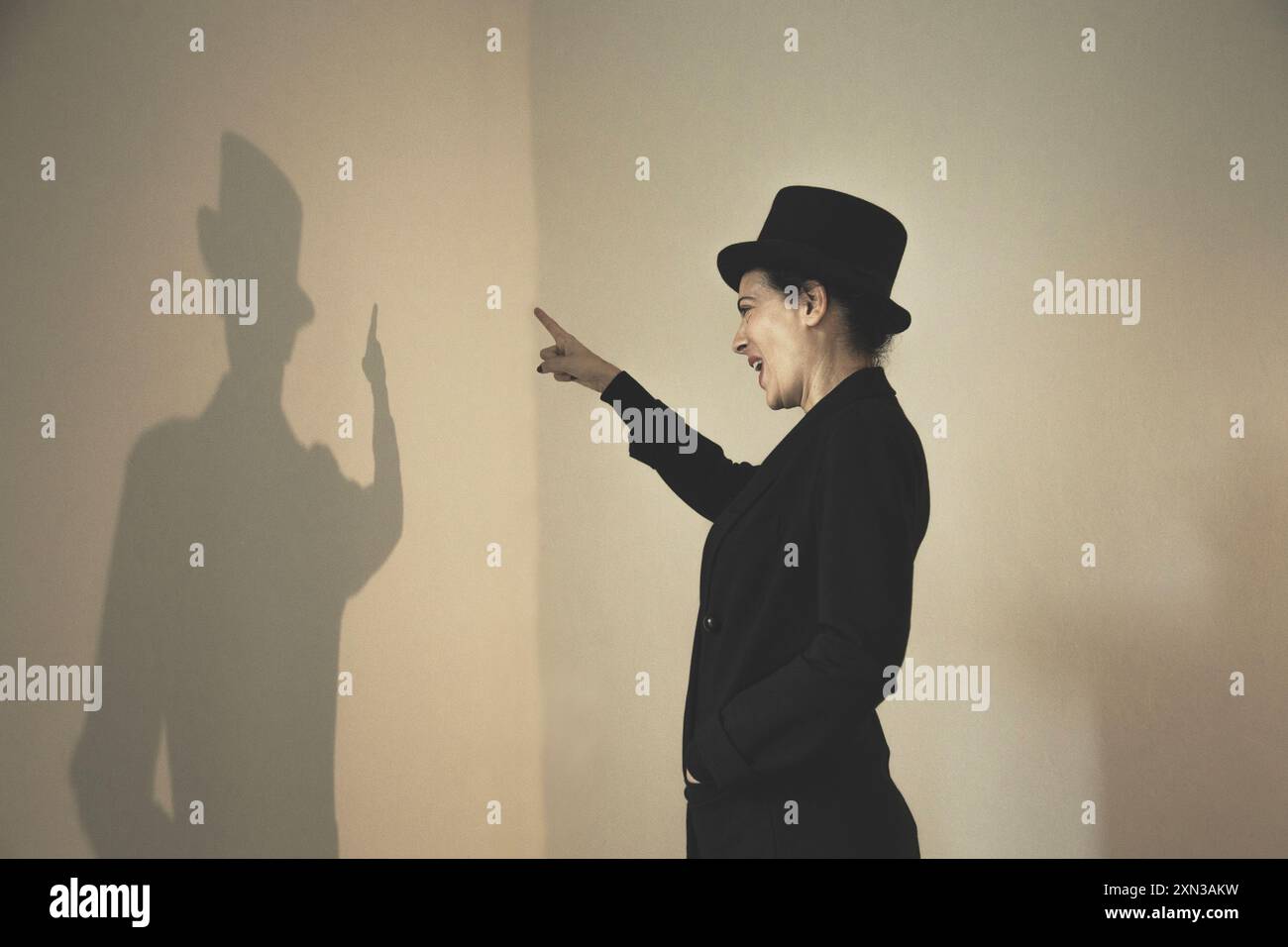 woman blames her shadow pointing finger at, abstract concept Stock ...