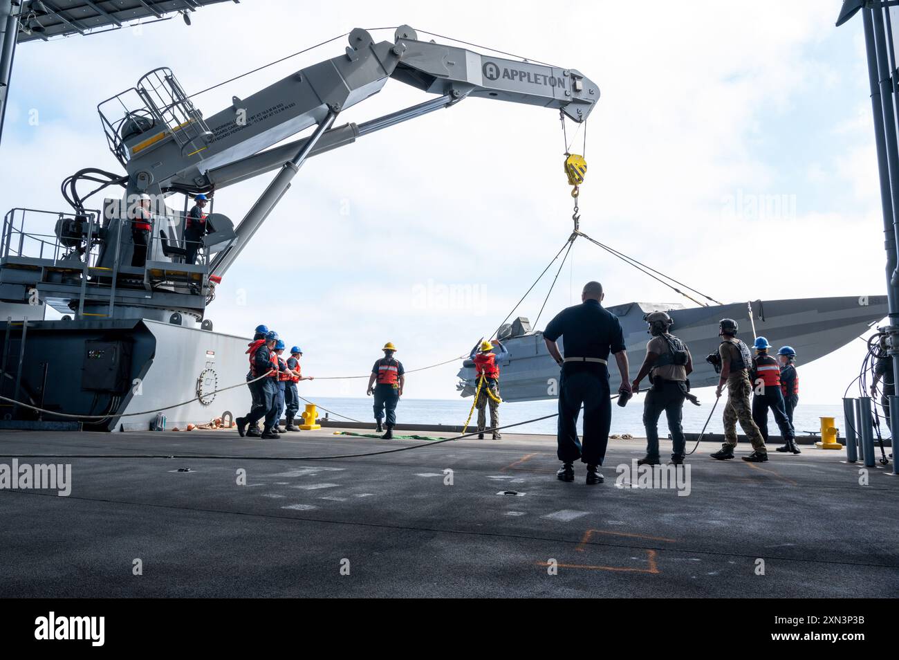 U.S. Navy sailors aboard the USS John L. Canley (ESB 6), a U.S. Navy ...