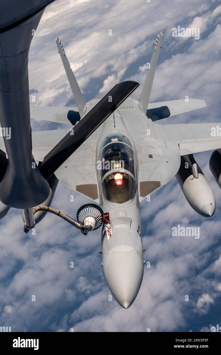 A U.S. Navy FA-18F Super Hornet refuels from a U.S. Air Force KC-135 ...