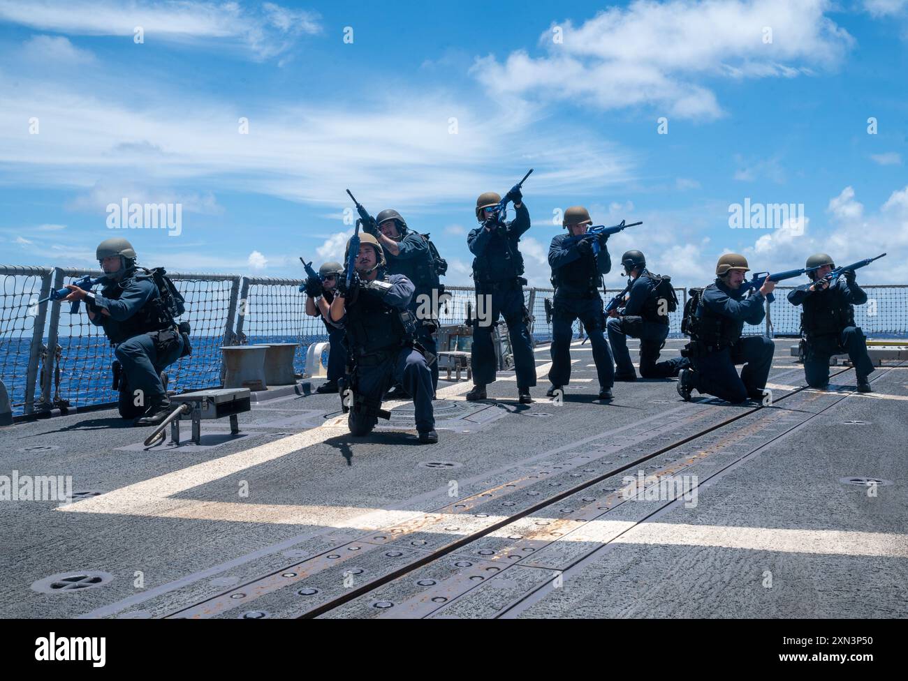 Sailors aboard Arleigh Burke-class guided-missile destroyer USS Sterett ...