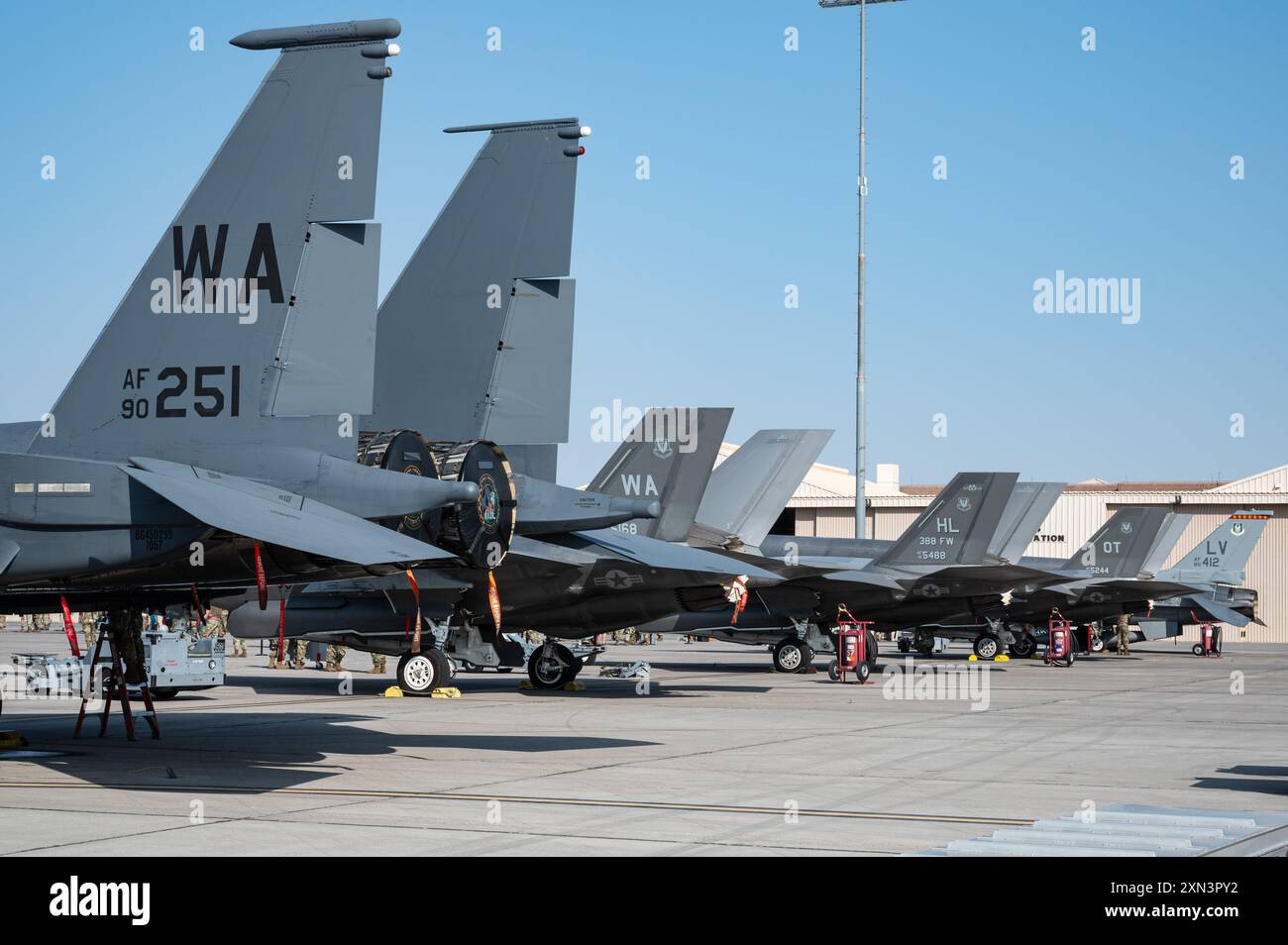 A U.S. Air Force F-15E Strike Eagle, three F-35A Lightning II, and an F ...