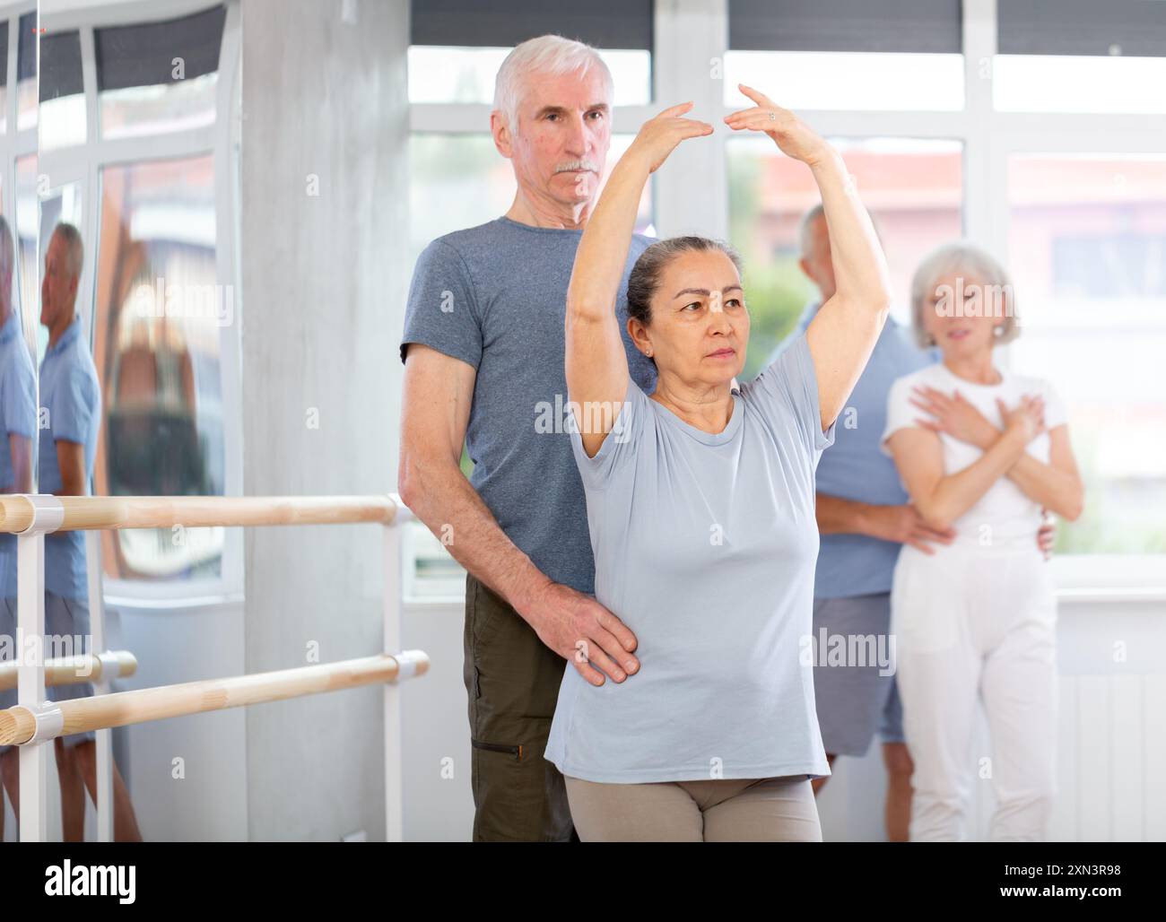 Contemporary mature ballet dancers couple performing graceful ...