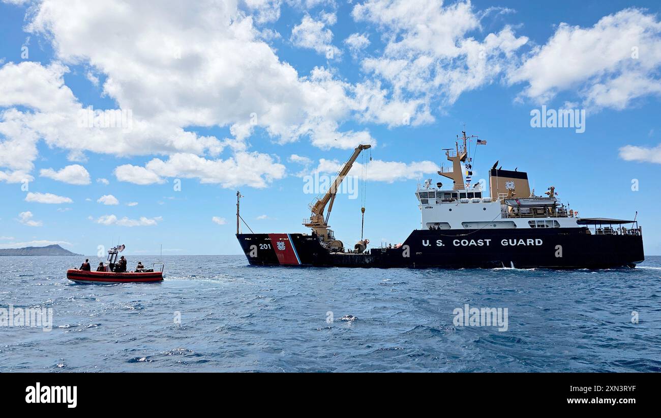 The U.S. Coast Guard Cutter Juniper (WLB-201) conducted sunken buoy ...