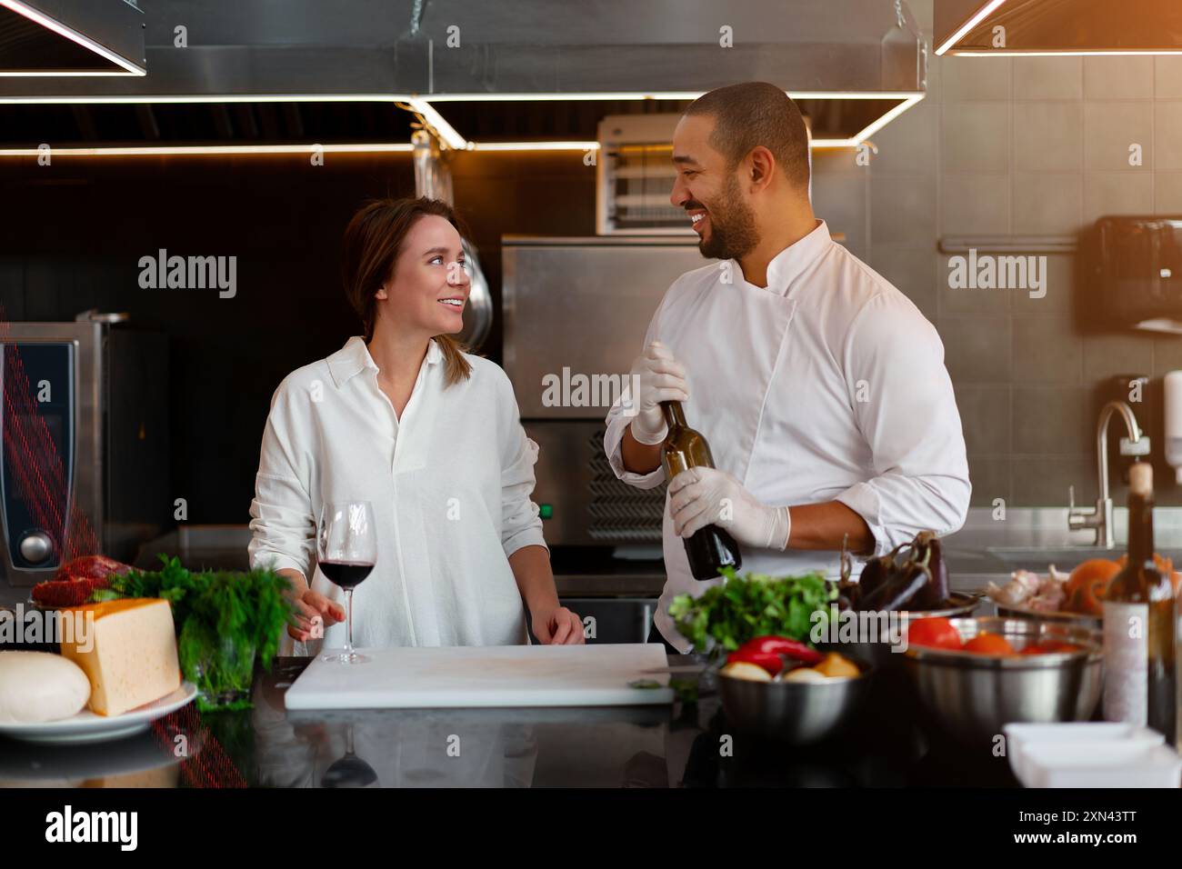 Diverse couple cooking together in hi-res stock photography and images ...