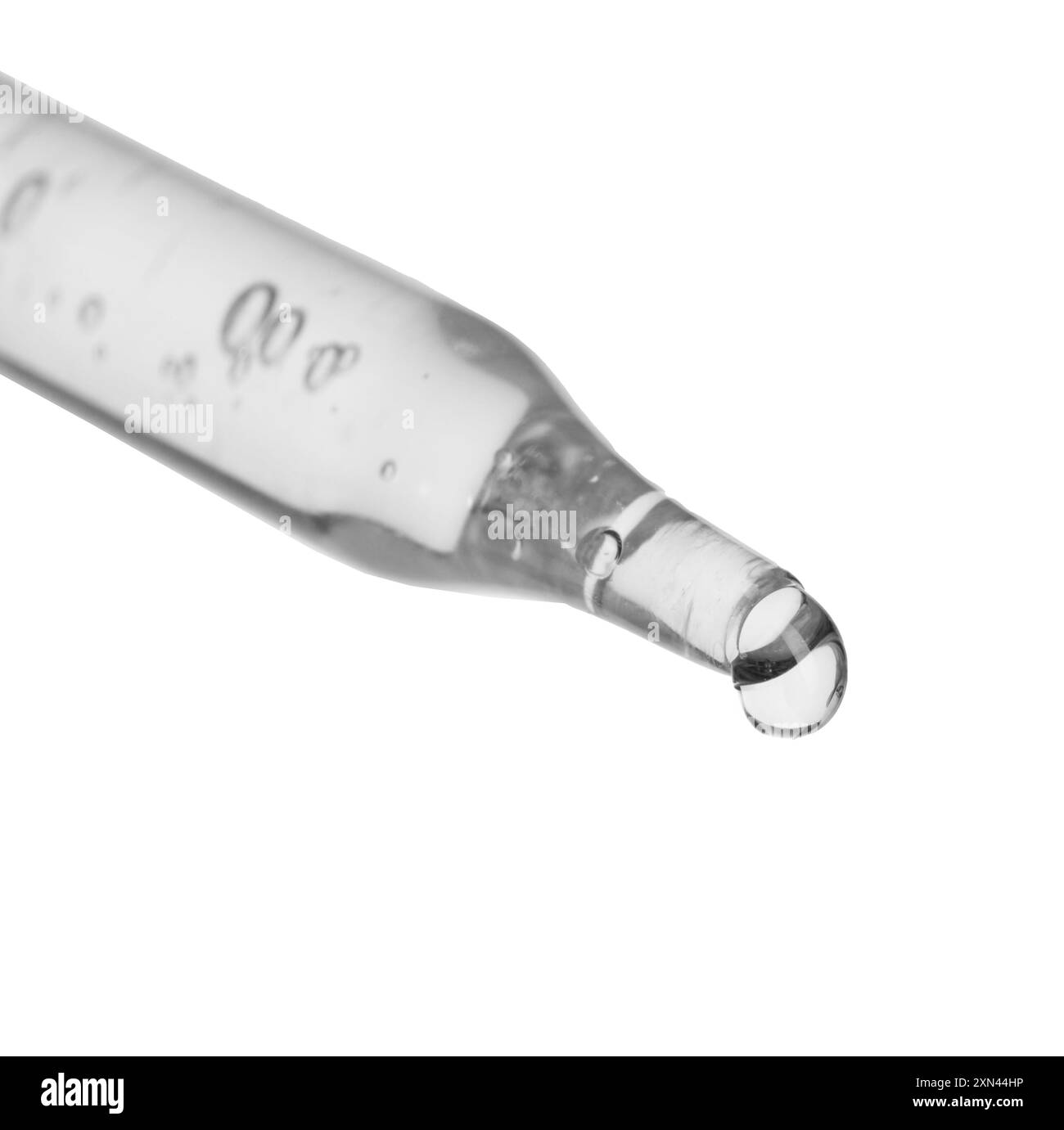 Dripping cosmetic serum from pipette on white background Stock Photo ...