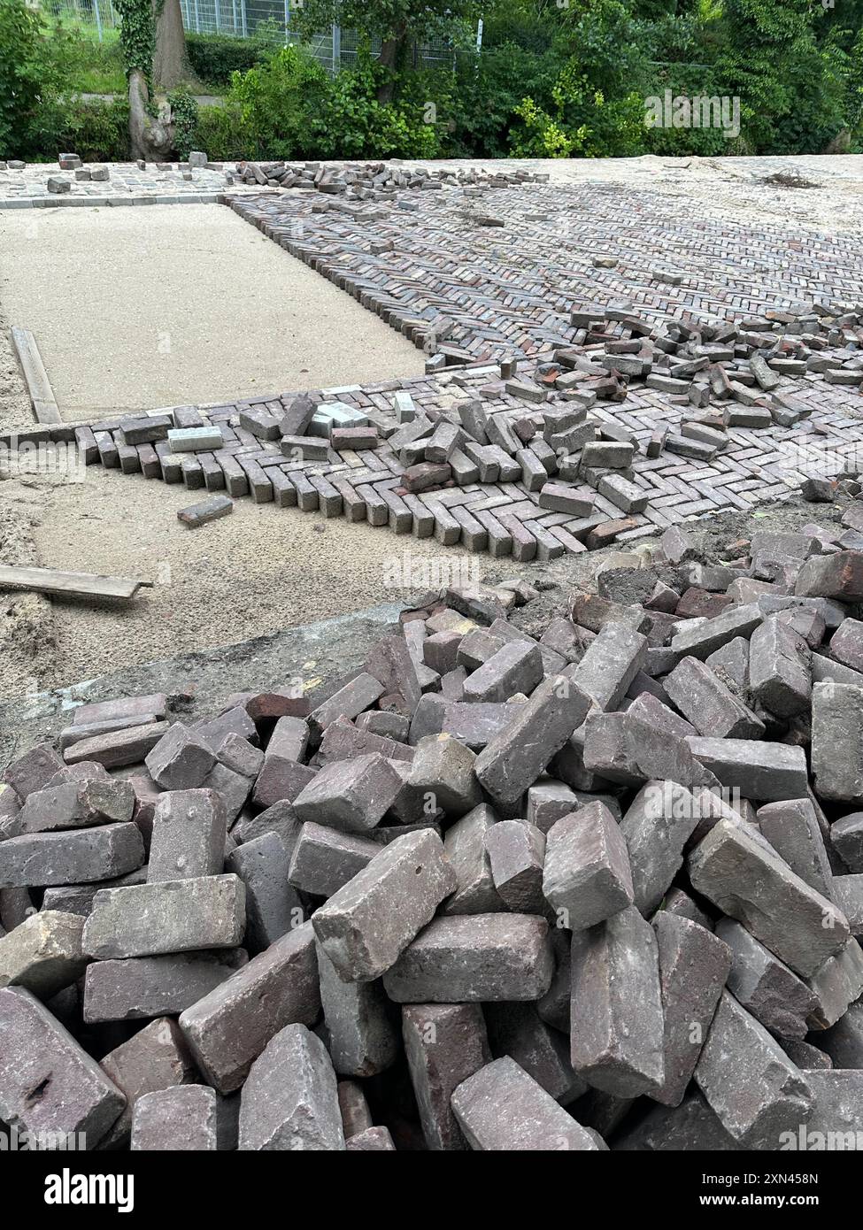 Process of laying paving stone blocks outdoors Stock Photo - Alamy