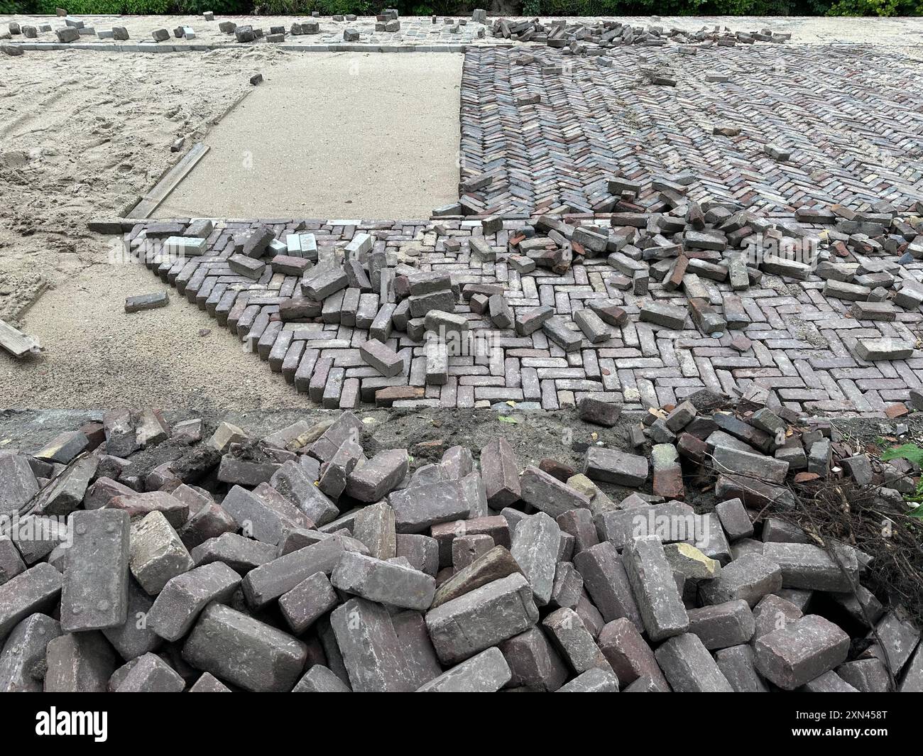 Process of laying paving stone blocks outdoors Stock Photo - Alamy