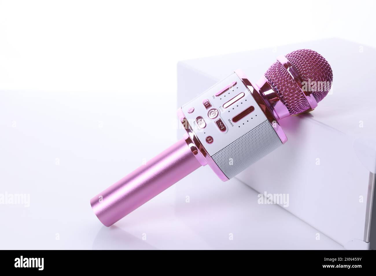 One pink karaoke microphone isolated on white Stock Photo - Alamy