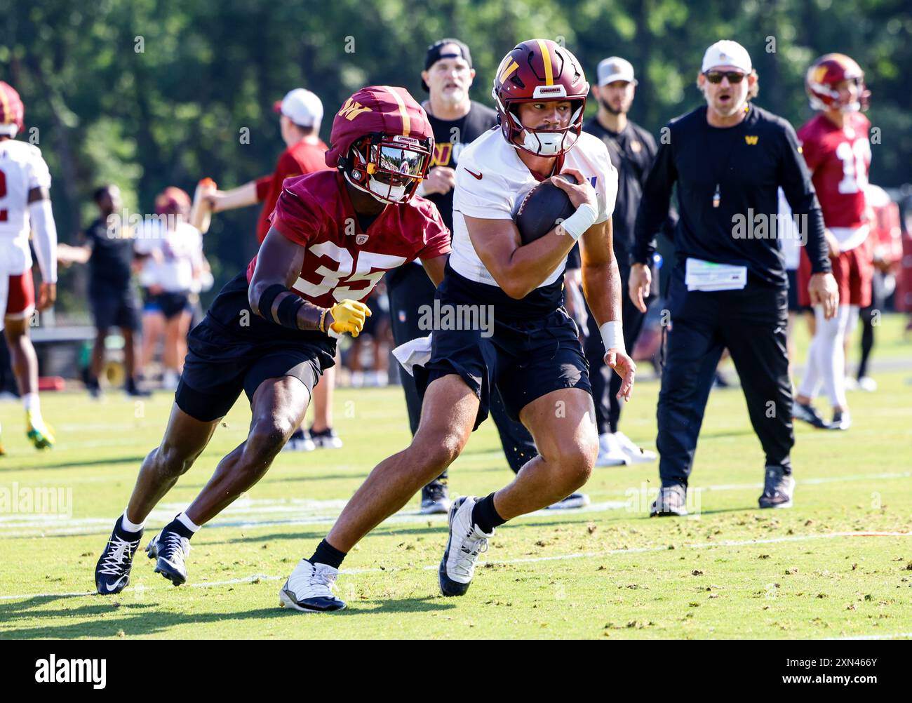 Washington Commanders tight end Cole Turner (85) and safety Percy ...