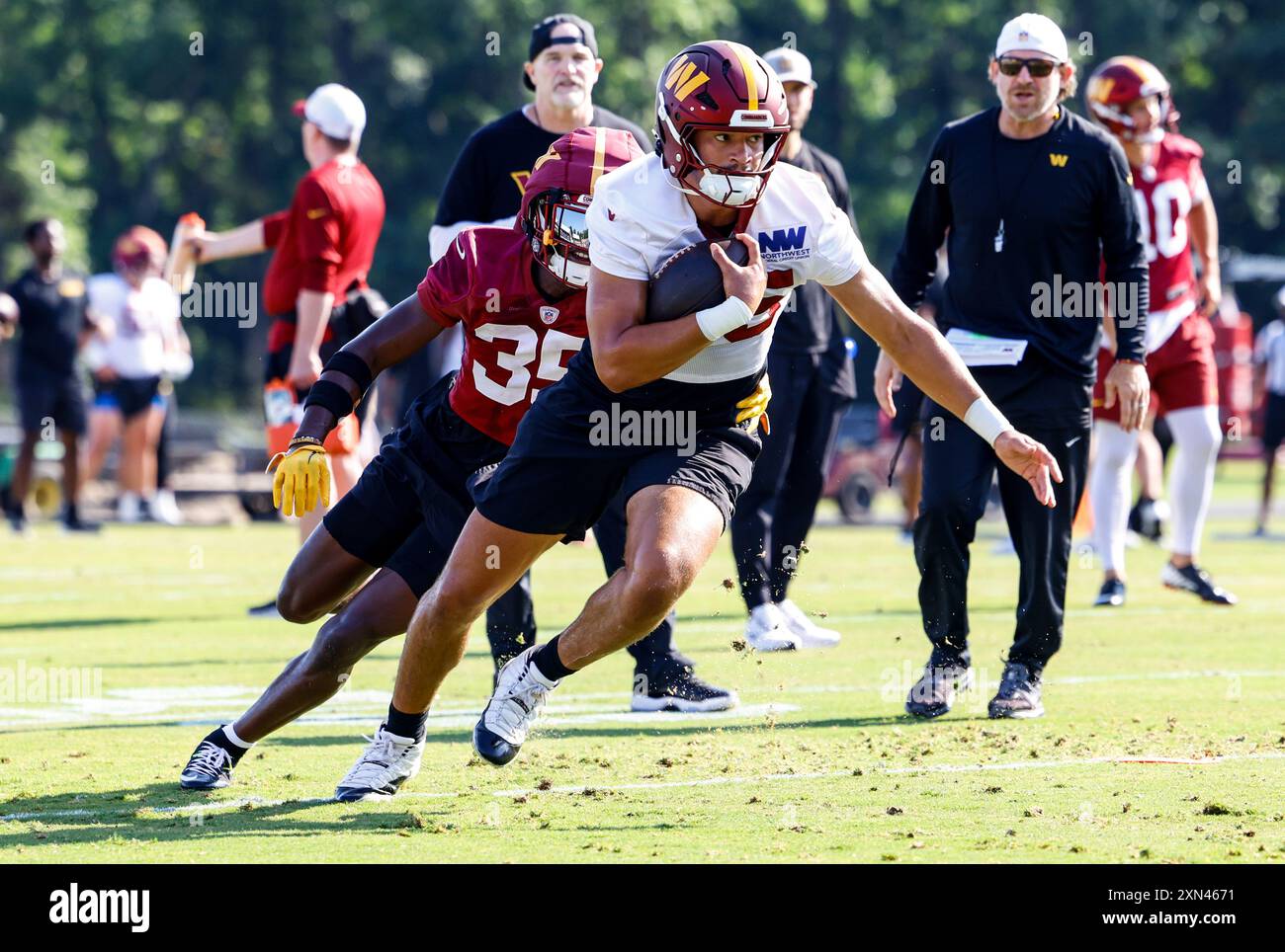 Washington Commanders tight end Cole Turner (85) and safety Percy ...