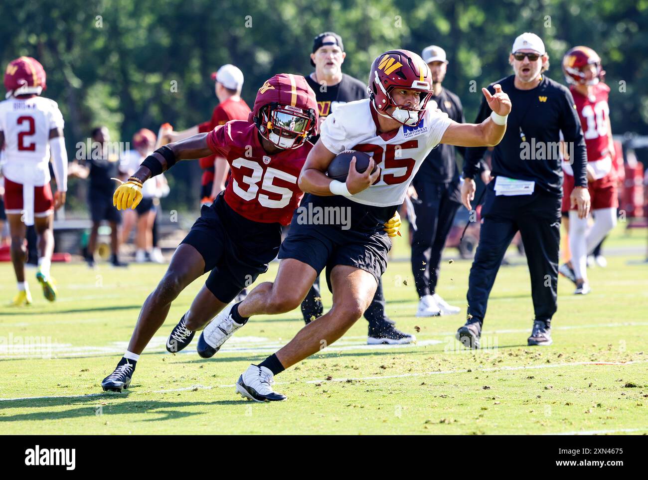 Washington Commanders tight end Cole Turner (85) and safety Percy ...