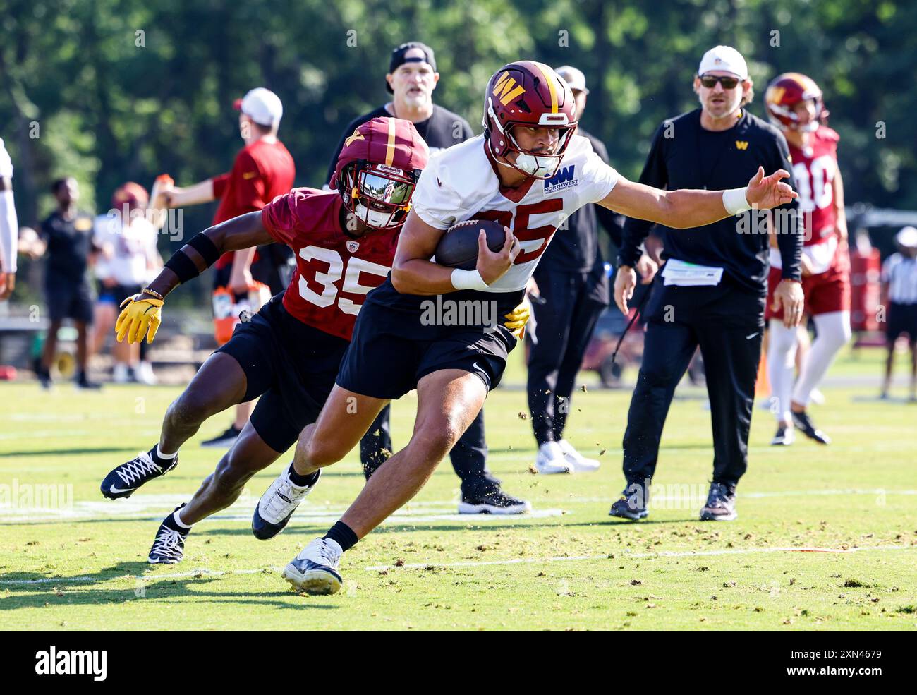 Washington Commanders tight end Cole Turner (85) and safety Percy ...