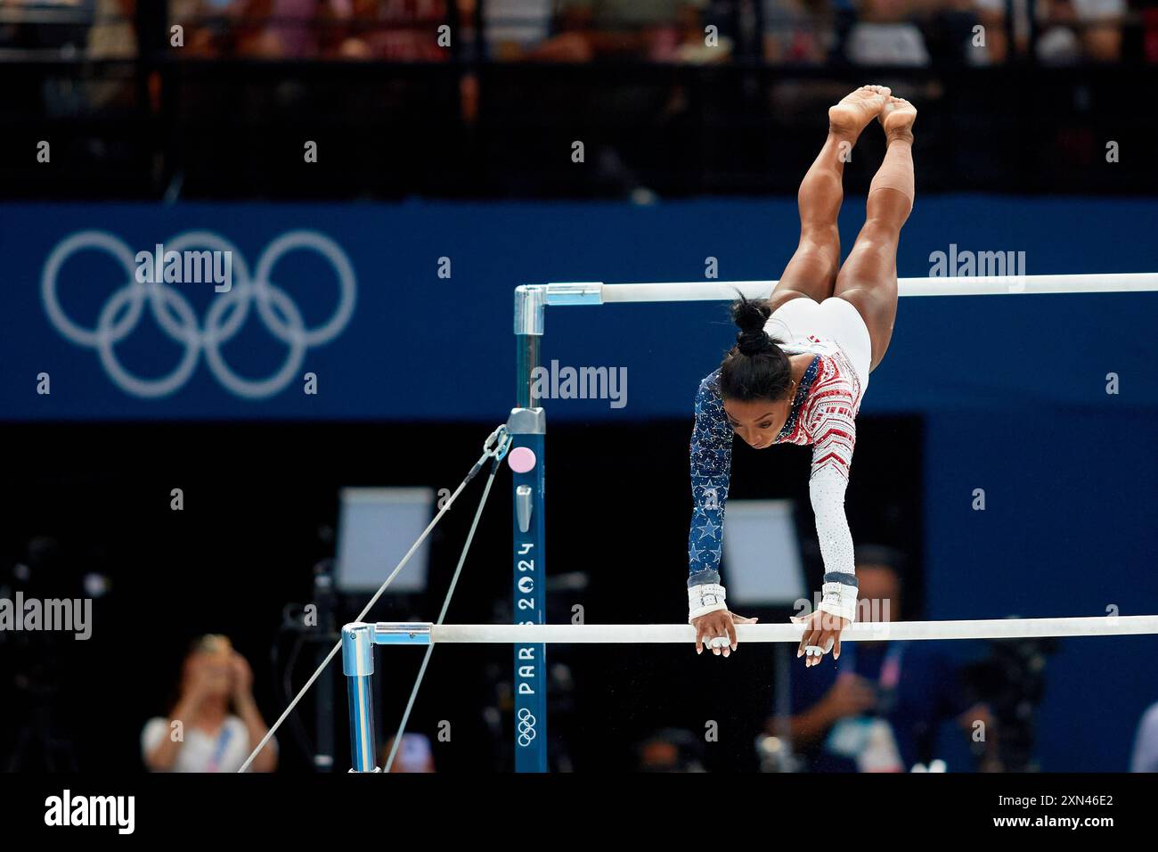 Simone Biles of Team United States competes on the uneven bars during ...