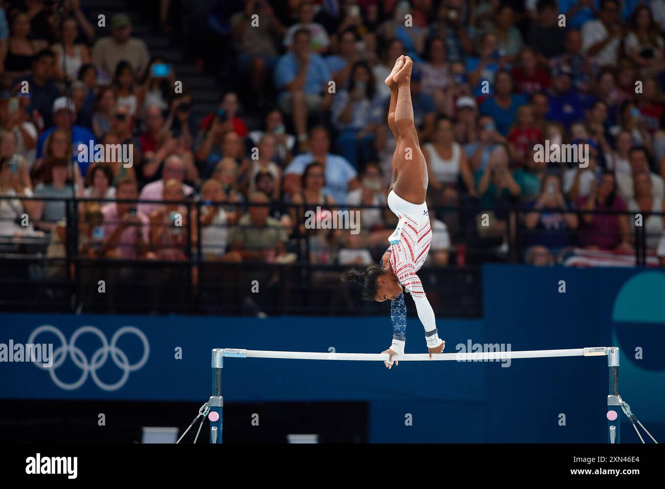 Simone Biles of Team United States competes on the uneven bars during ...