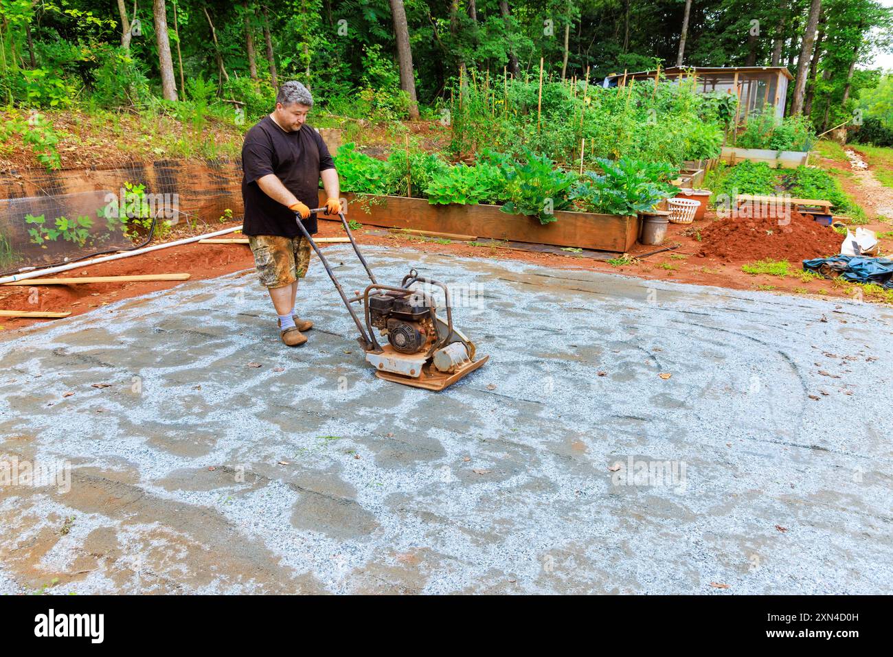 Compaction sand using vibratory tamping machine during construction of ...