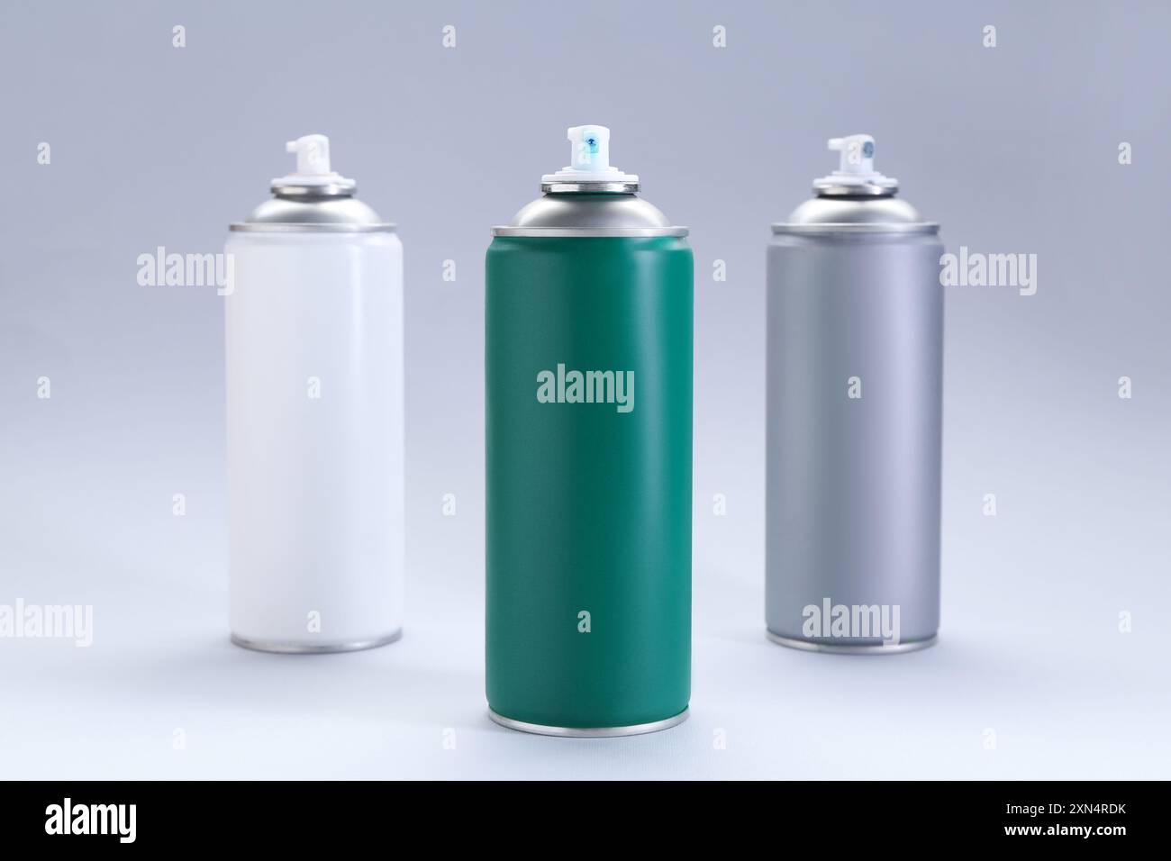 Three spray paint cans hi-res stock photography and images - Alamy