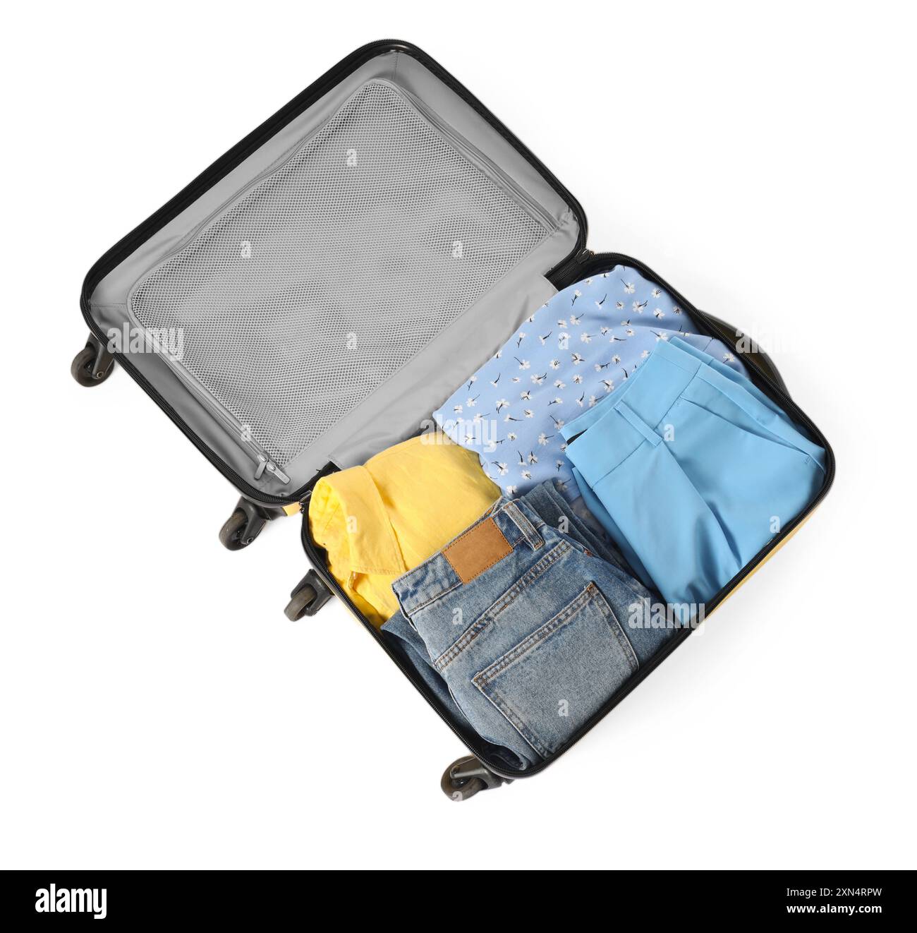 Open suitcase with clothes packed for travelling isolated on white, top ...