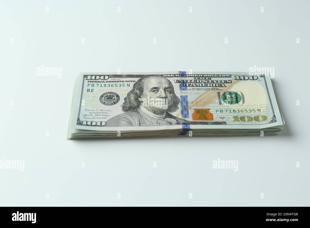Stack of dollar banknotes on white background Stock Photo - Alamy