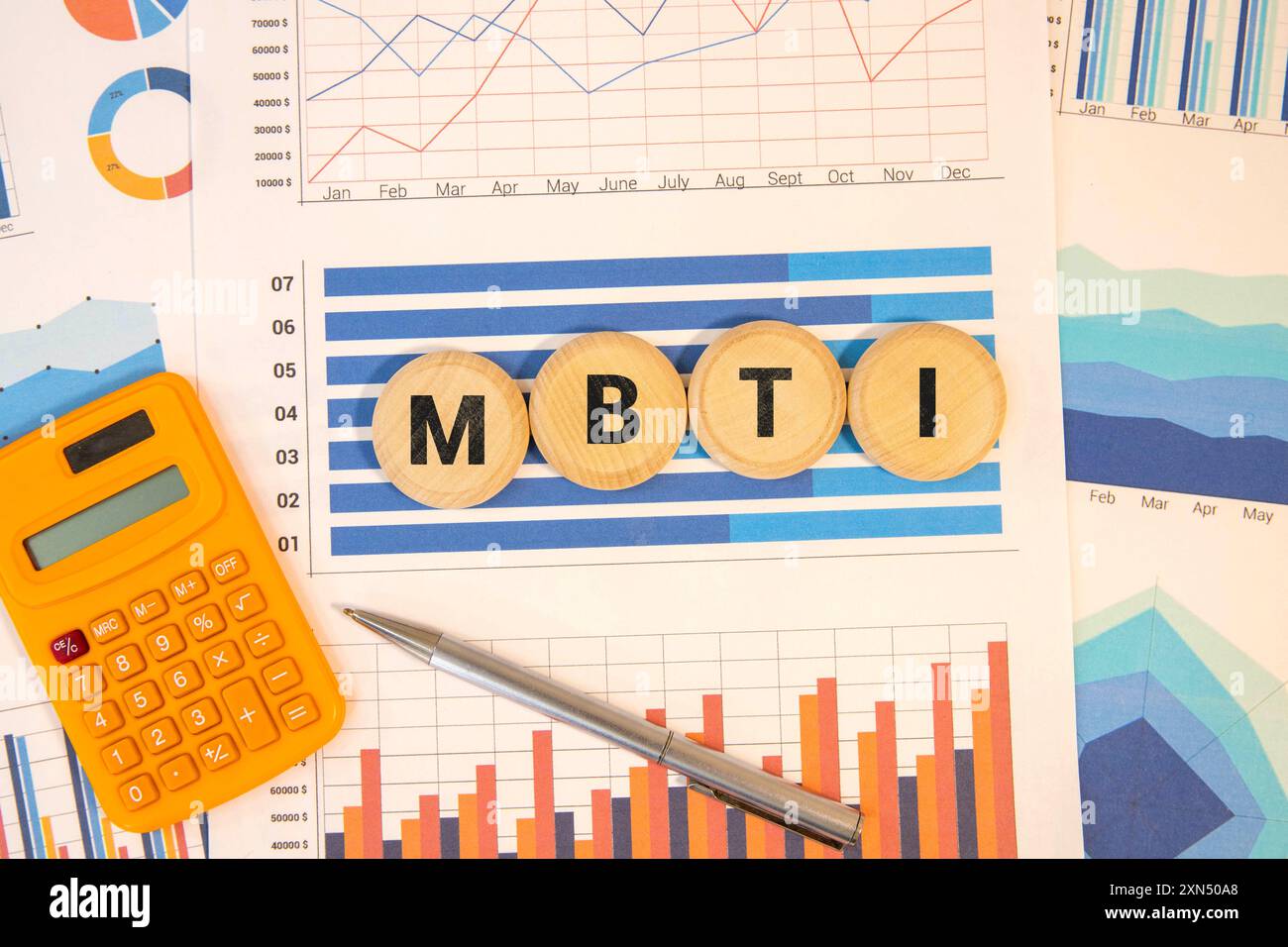 This photo features wooden dice spelling MBTI, perfect for illustrating ...