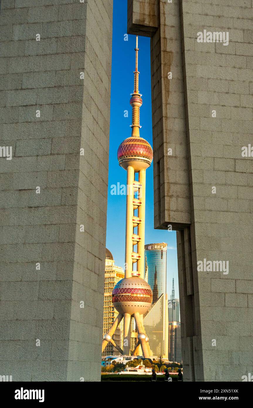 Shanghai’s Oriental Pearl Tower seen through the gap in Huangpu Park’s ...