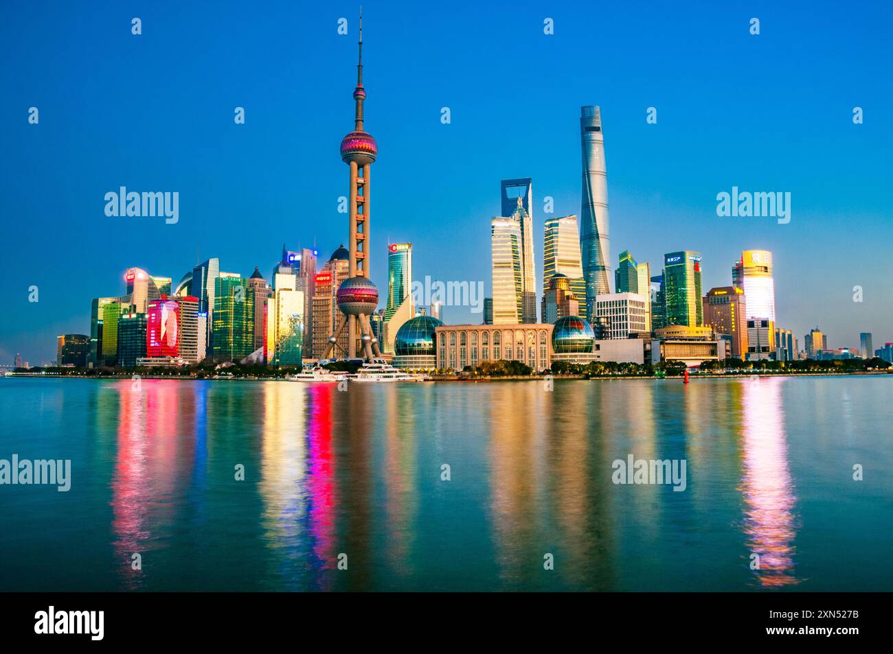 Iconic view of Shanghai’s Pudong skyline taken from the Bund at dusk ...