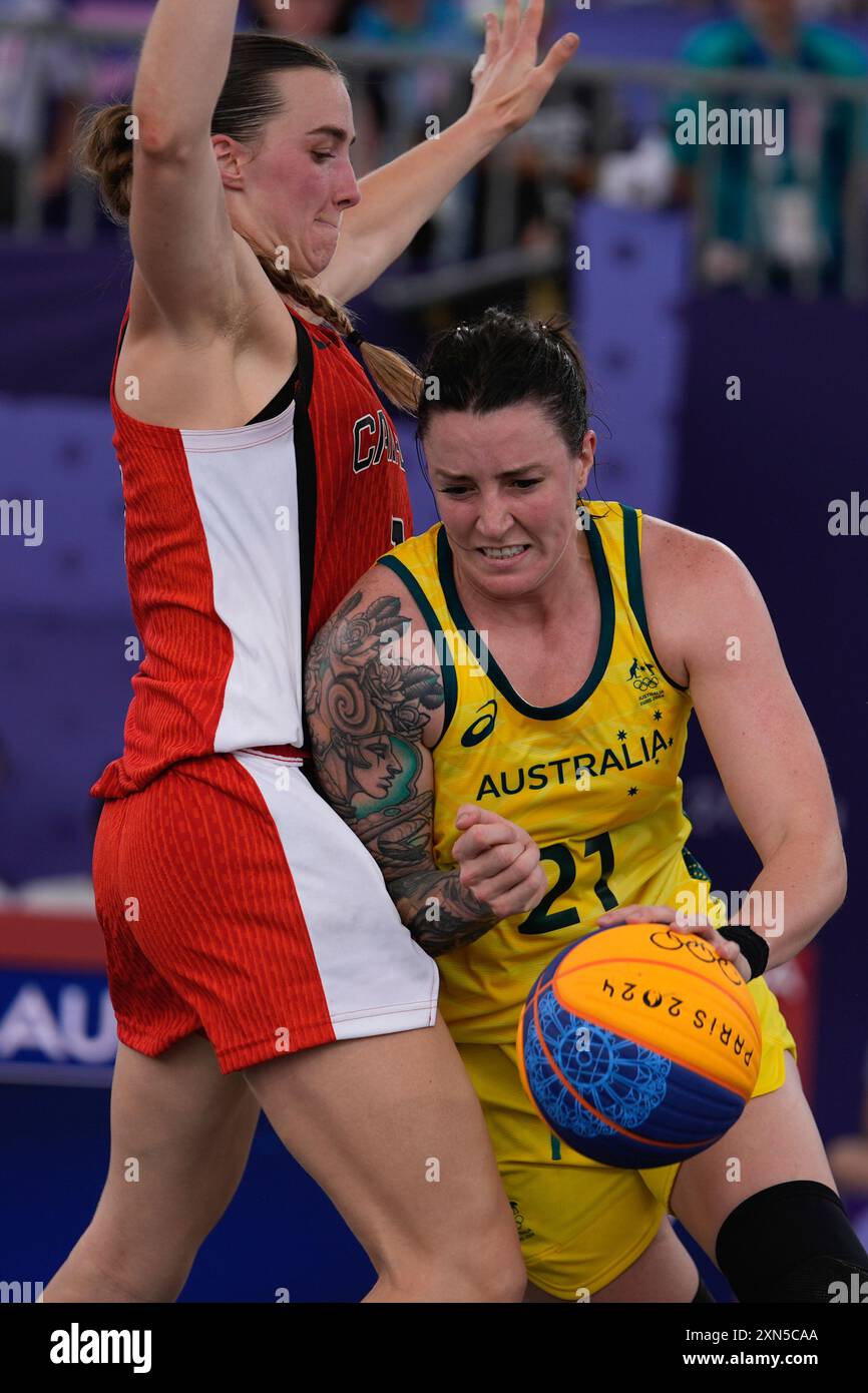 Marena Whittle of Australia drives past Paige Crozon of Canada in the ...