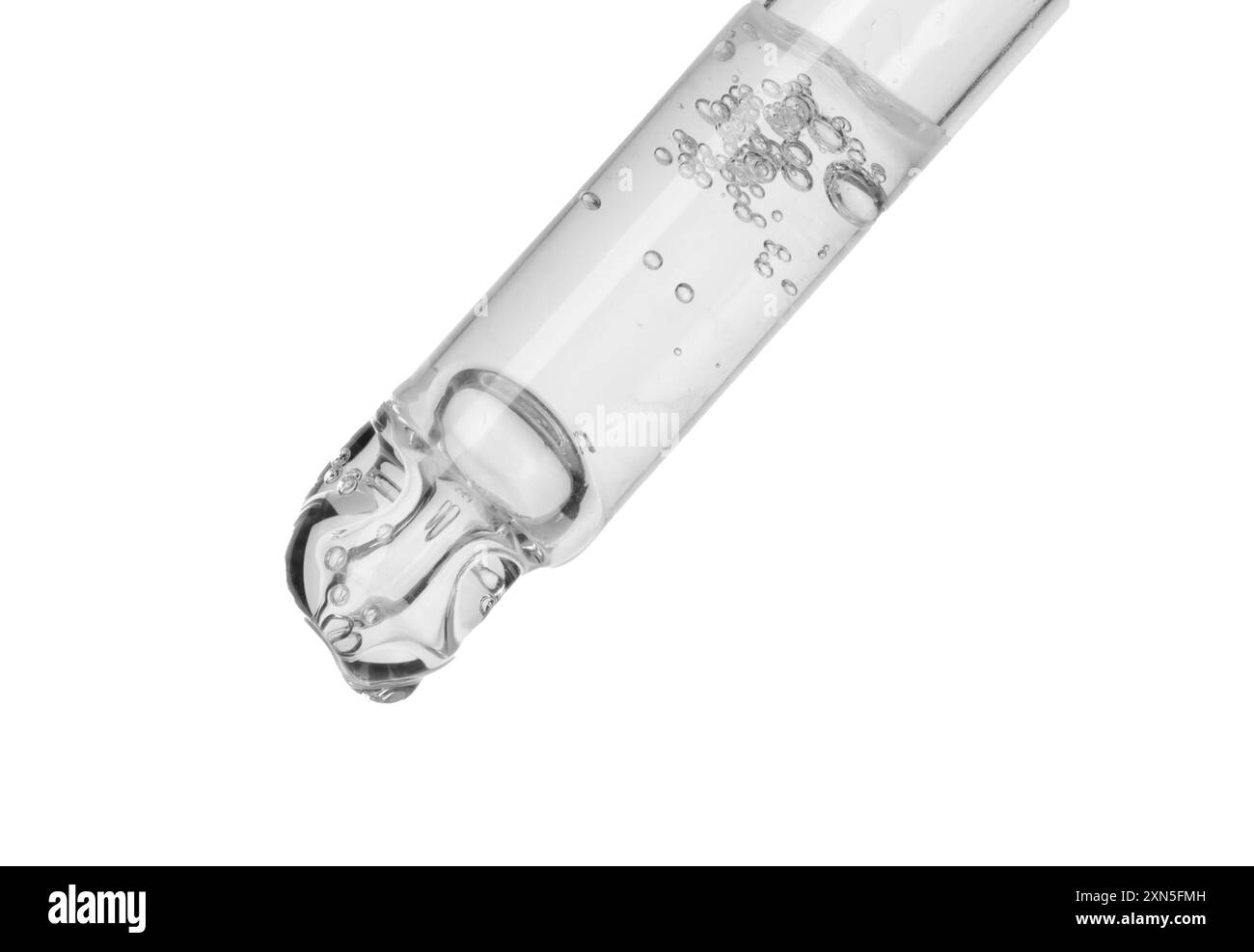 Dripping cosmetic serum from pipette on white background Stock Photo ...