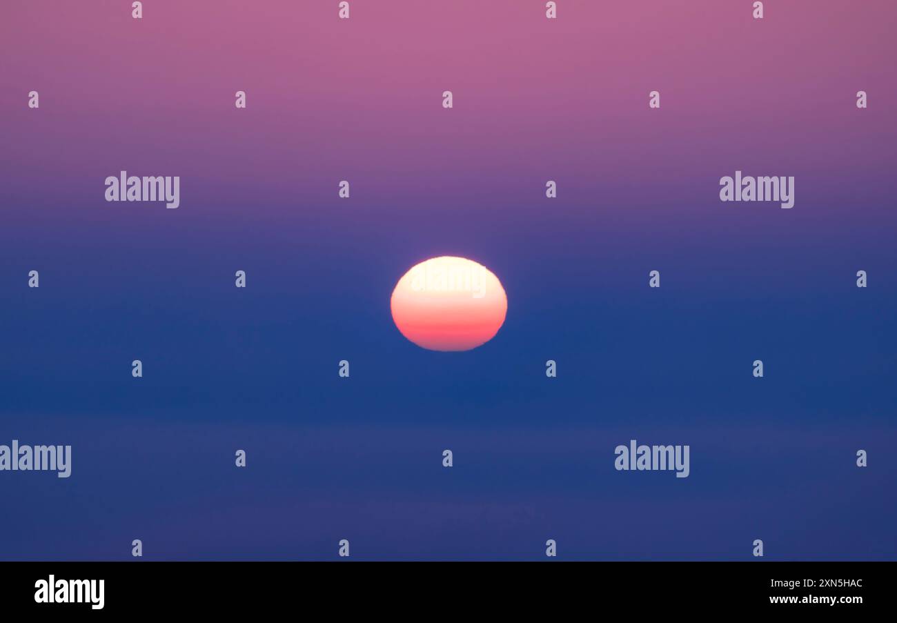 Setting Sun descending into a fog bank looking due west on 20 March ...