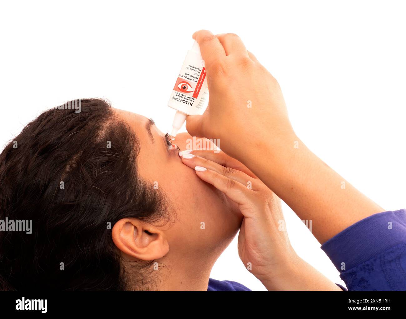 Woman applying lubricant eye drops Stock Photo - Alamy