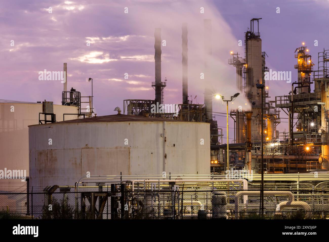 Carbon dioxide, a global warming gas, escapes from an industrial oil ...