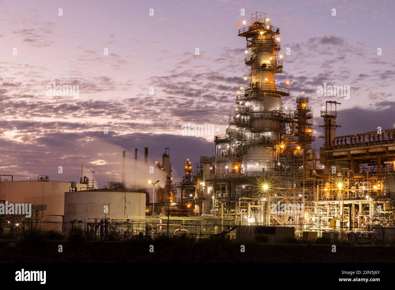 Carbon dioxide, a global warming gas, escapes from an industrial oil ...