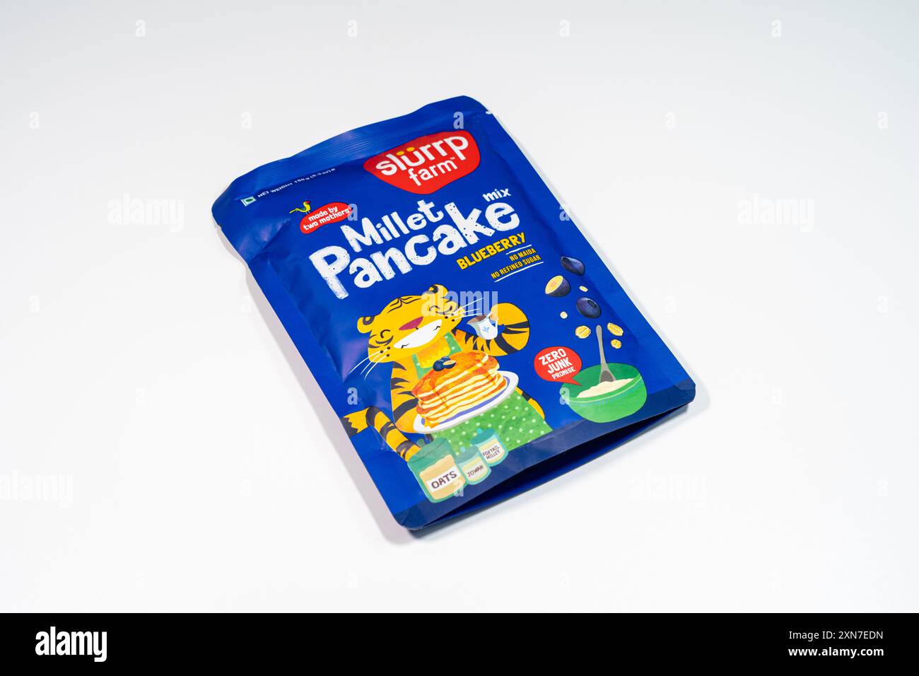 A packet of Slurrp Farm Millet Pancake Mix Blueberry on white ...