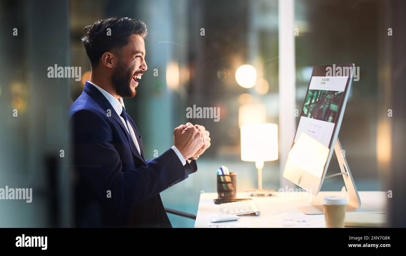 Computer, night and business man celebrate success, reward and winning ...