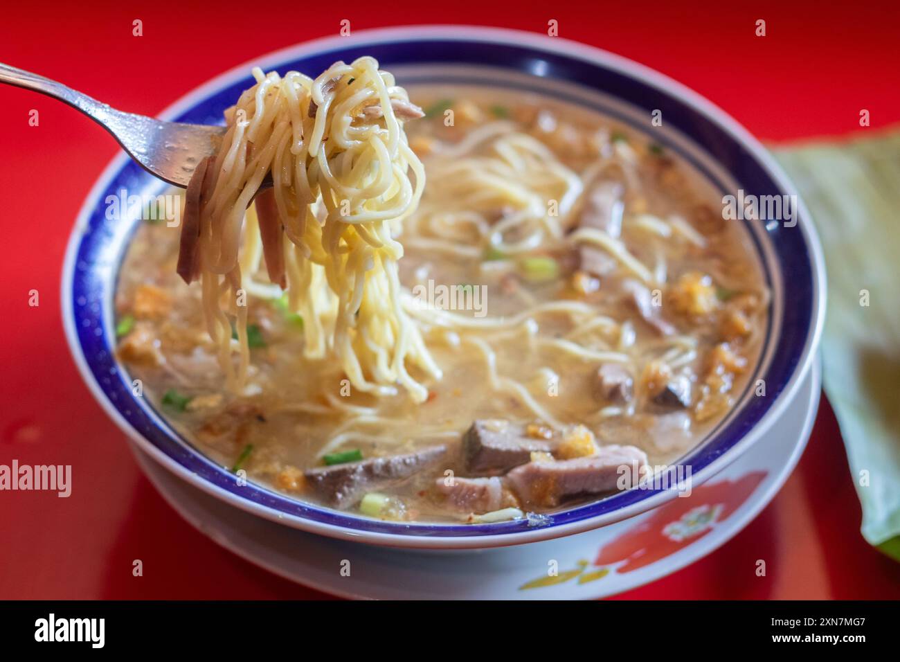 A bowl of warm batchoy, a local noodle dish popular in Iloilo City, the ...