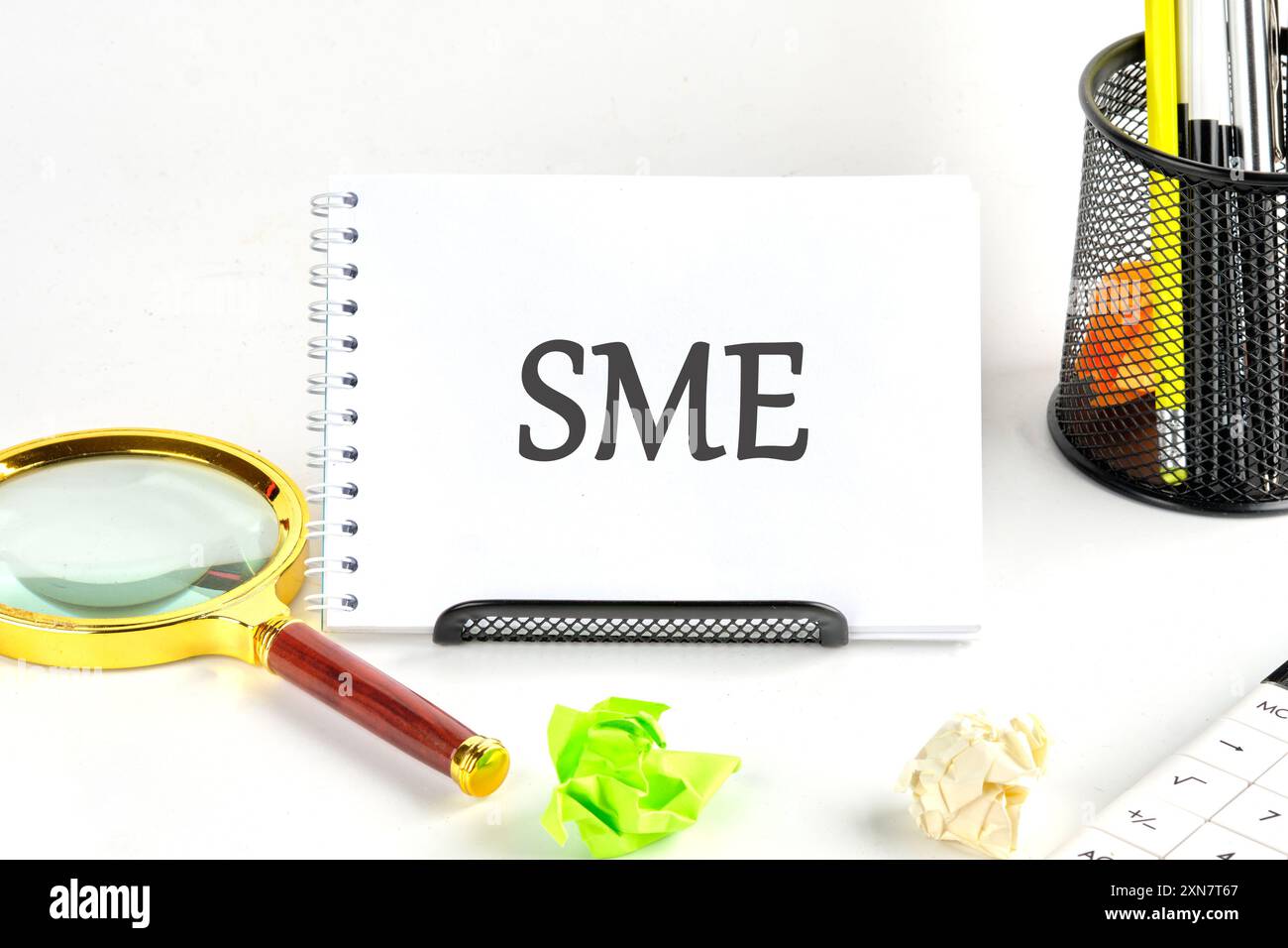 The words SME Small and Medium Size Enterprises written on a blank ...