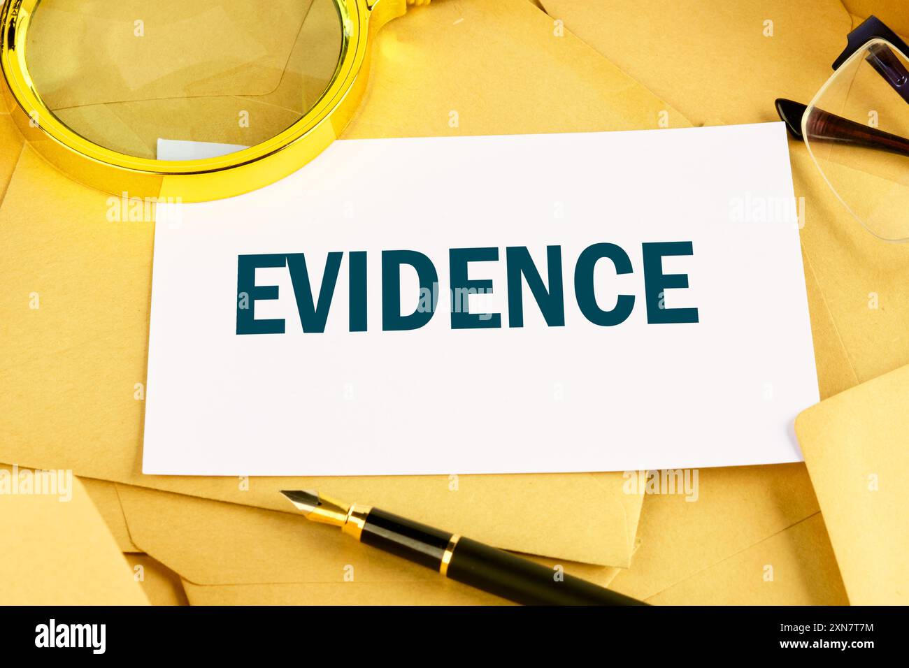 A business concept. Word Evidence written on a white business card ...