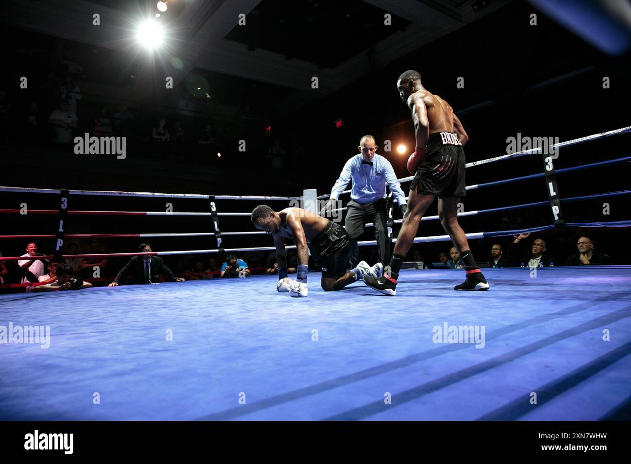 Tristan Brookes (red gloves) faces Mikhail Miller during a boxing match ...