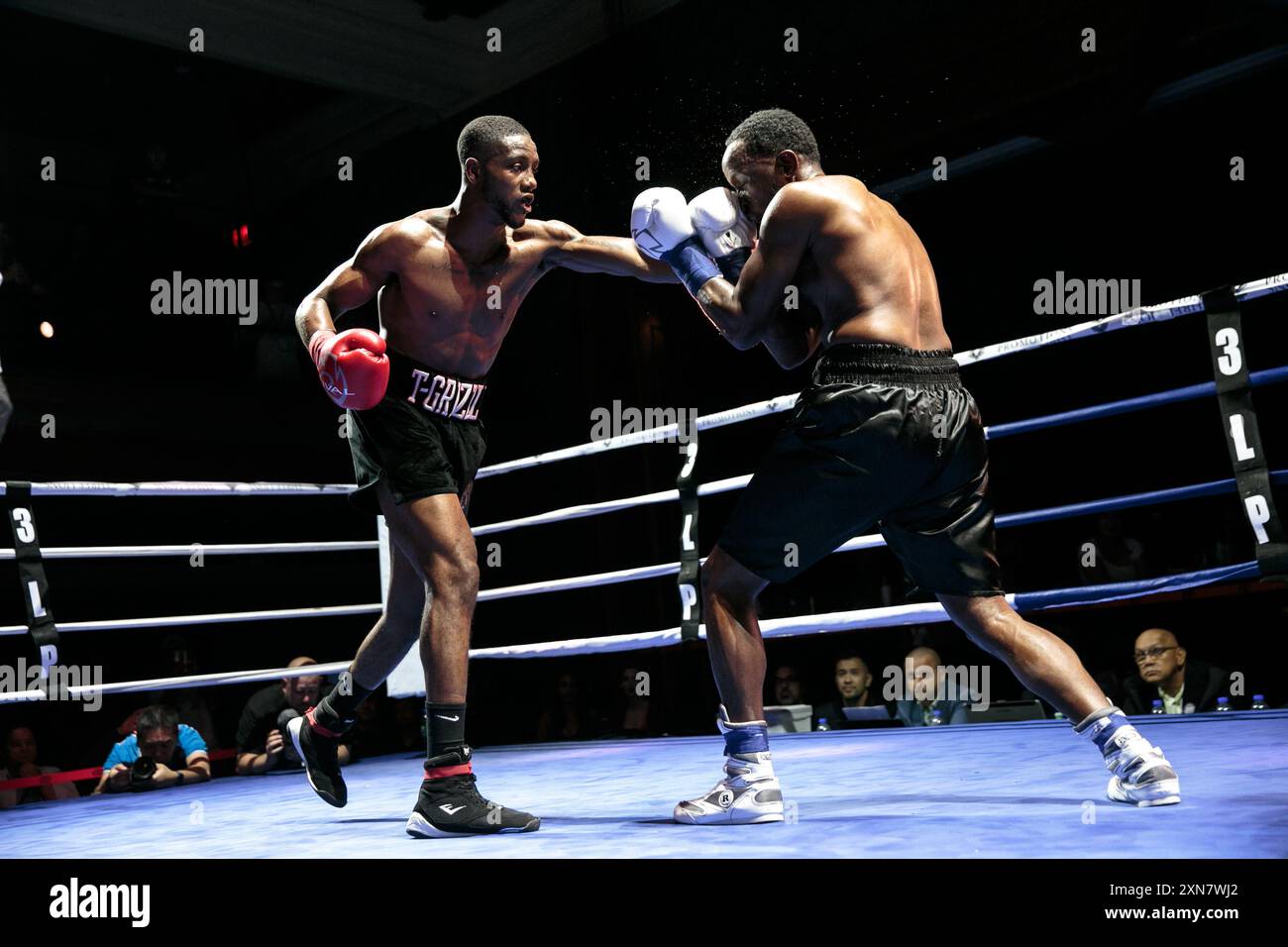 Tristan Brookes (red gloves) faces Mikhail Miller during a boxing match ...