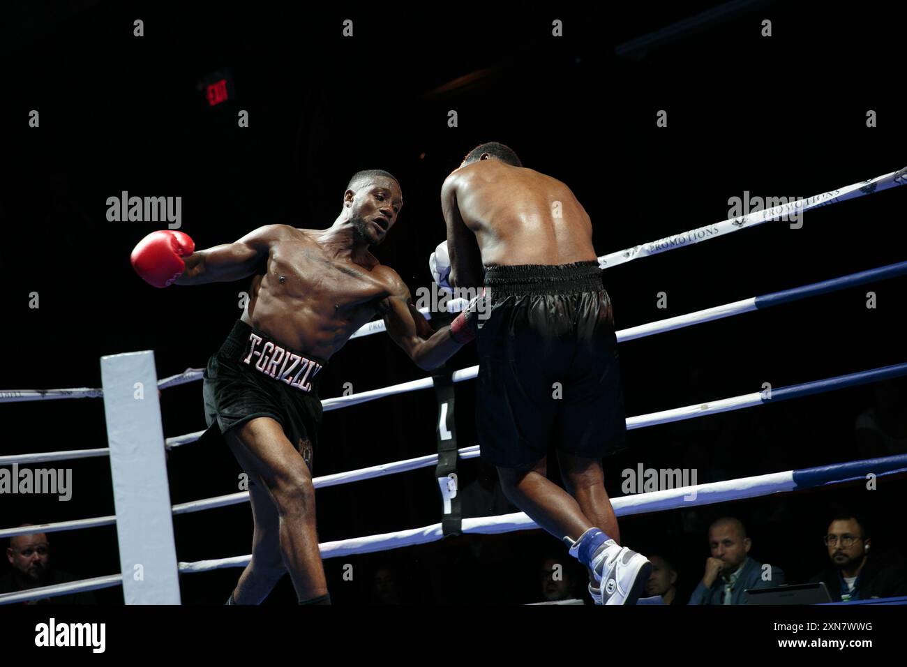 Tristan Brookes (red gloves) faces Mikhail Miller during a boxing match ...