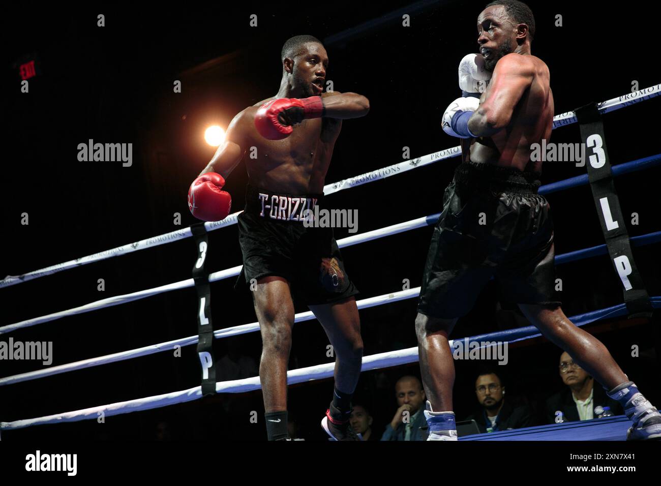 Tristan Brookes (red gloves) faces Mikhail Miller during a boxing match ...