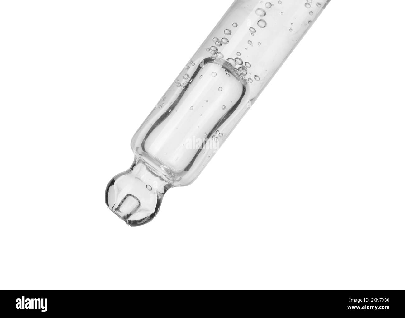 Dripping cosmetic serum from pipette on white background Stock Photo ...