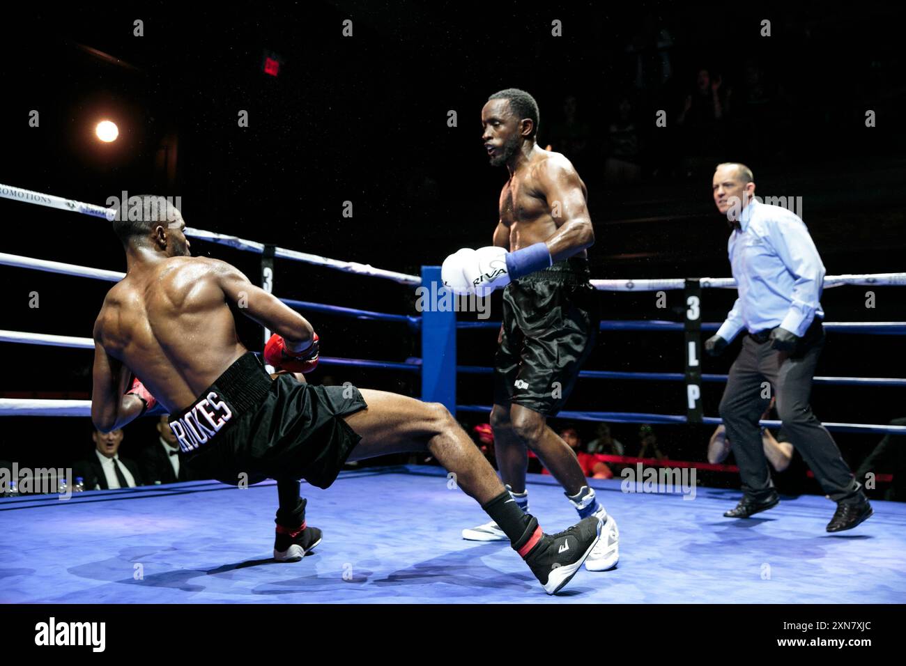 Tristan Brookes (red gloves) faces Mikhail Miller during a boxing match ...