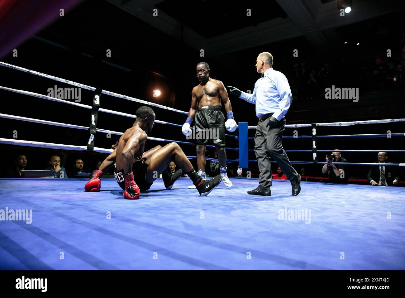 Tristan Brookes (red gloves) faces Mikhail Miller during a boxing match ...