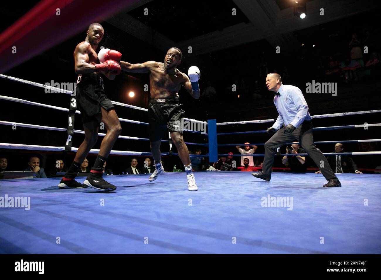Tristan Brookes (red gloves) faces Mikhail Miller during a boxing match ...